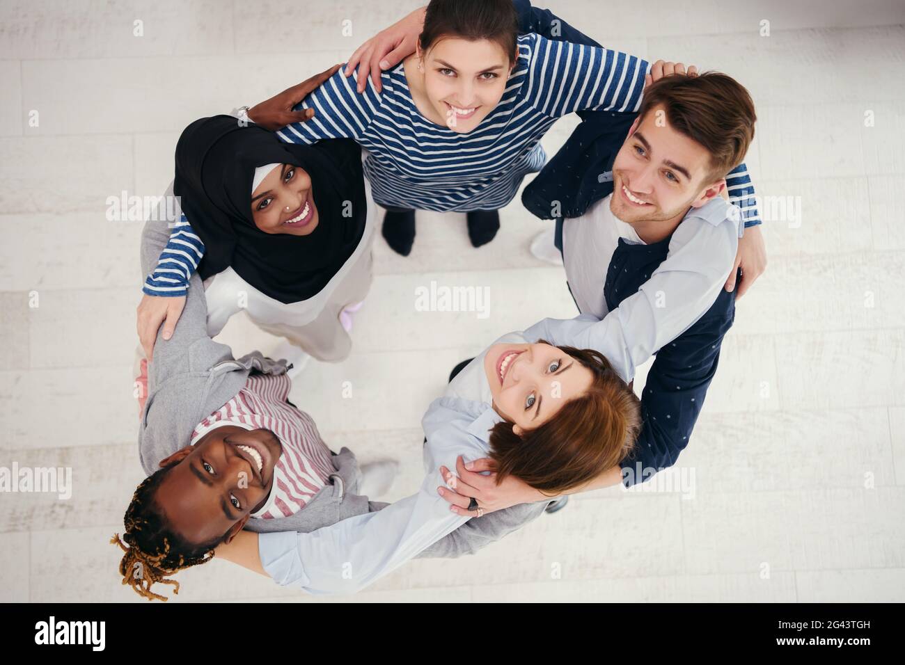 Top view of diverse group of people standing embracing and symbolizing ...