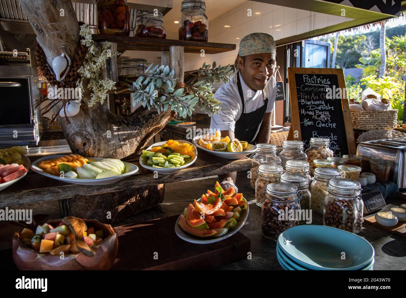 Smiling chef behind a fantastic breakfast buffet in the Tovolea ...