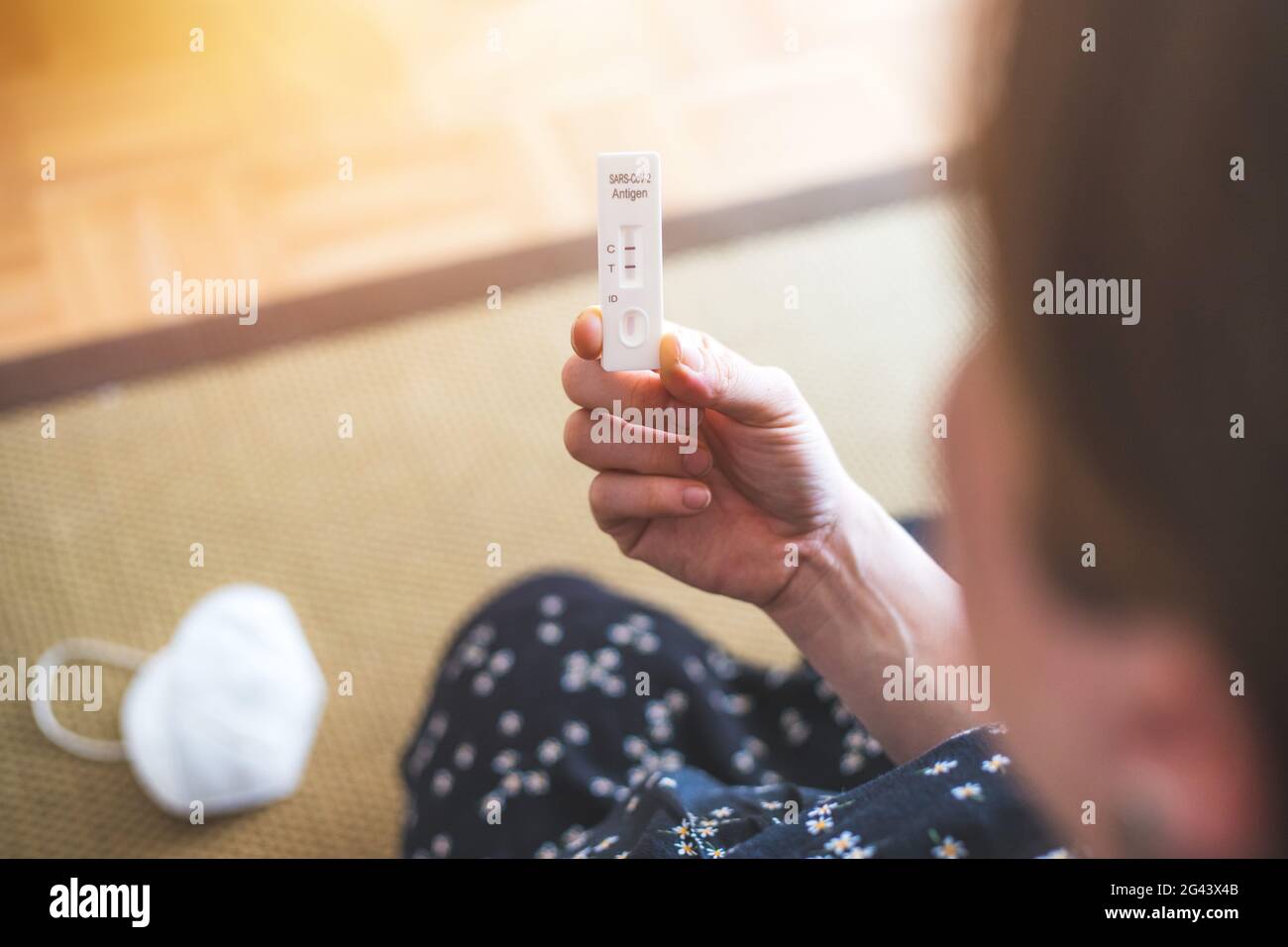 Express corona test at home: Close up of female fingers holding a ...