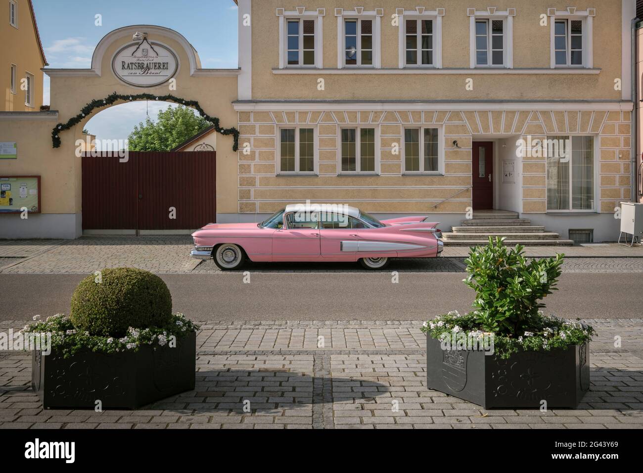 pink red American vintage car parked in front of brewery, Rain am Lech ...