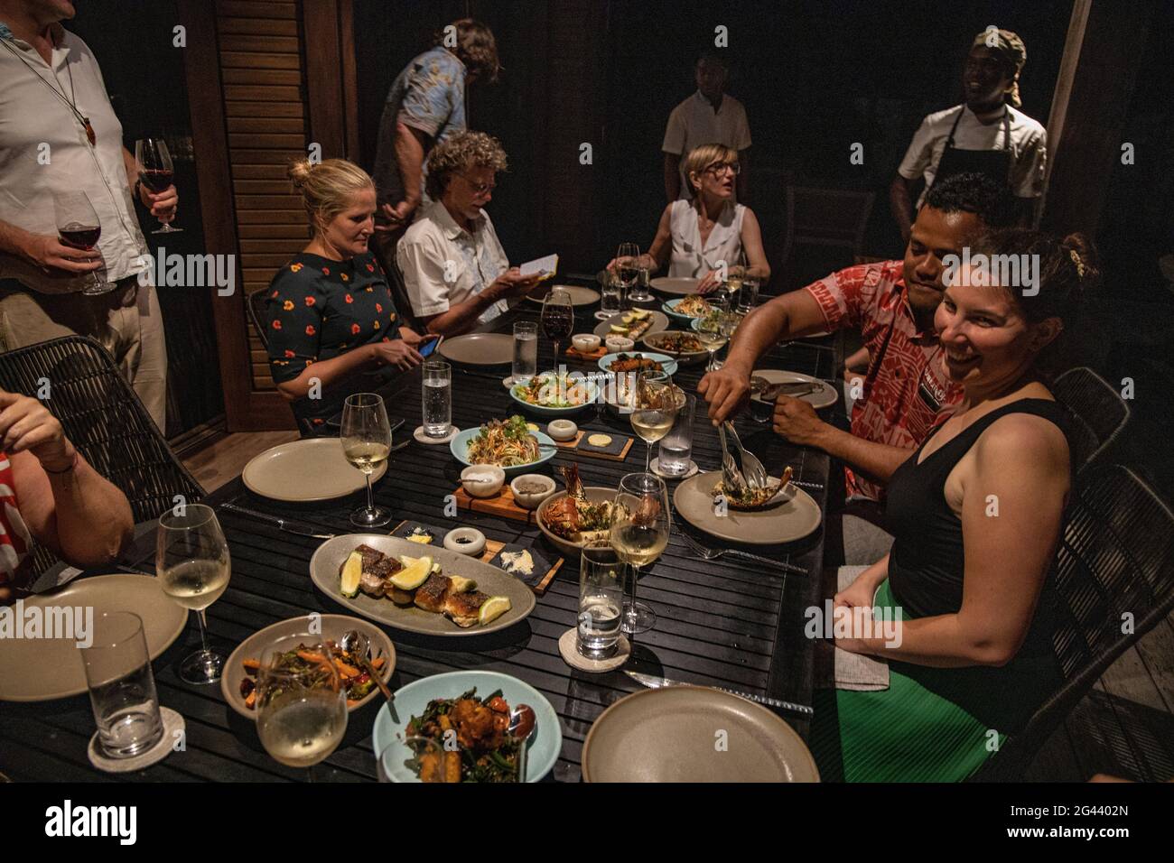 People enjoying barbecue dinner in a Residence Villa accommodation at ...