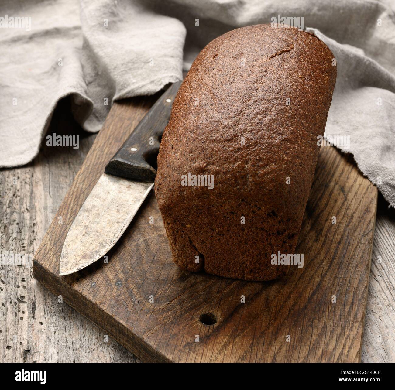 Baked rectangular rye flour bread on brown board Stock Photo - Alamy