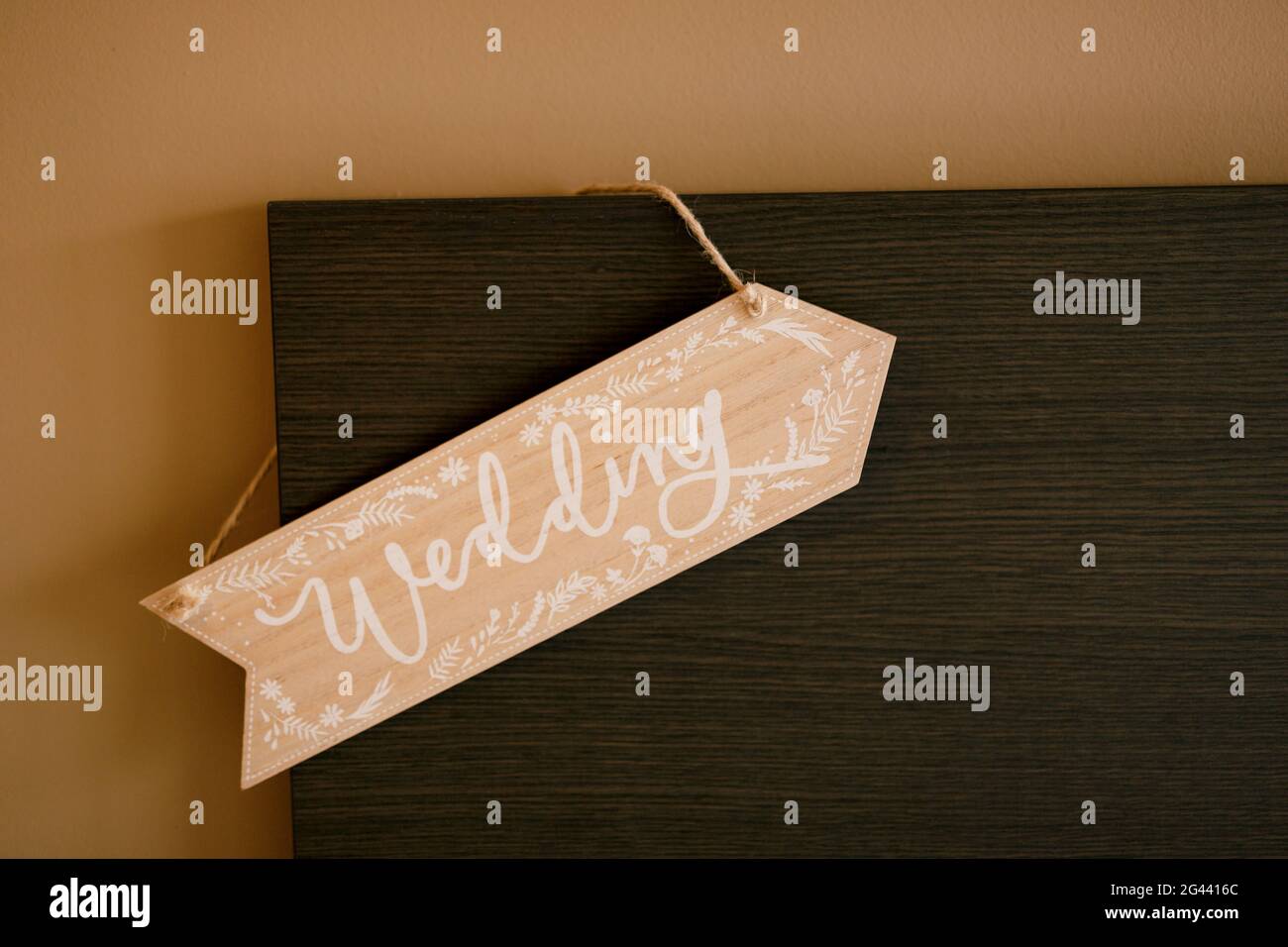 Wedding sign hanging on a wooden headboard Stock Photo - Alamy