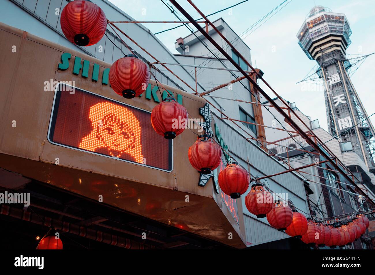 Neon sign with Shinsekai Tower in the background in Osaka, Japan Stock ...