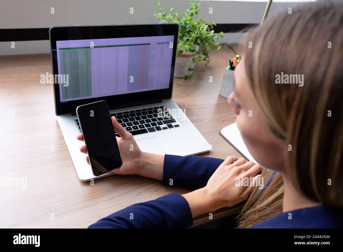 Caucasian businesswoman sitting at desk having video call conversation ...