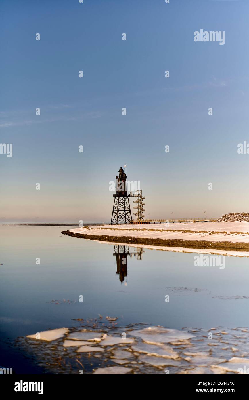 Obereversand lighthouse with mirror image, Dorum, Lower Saxony, Germany ...