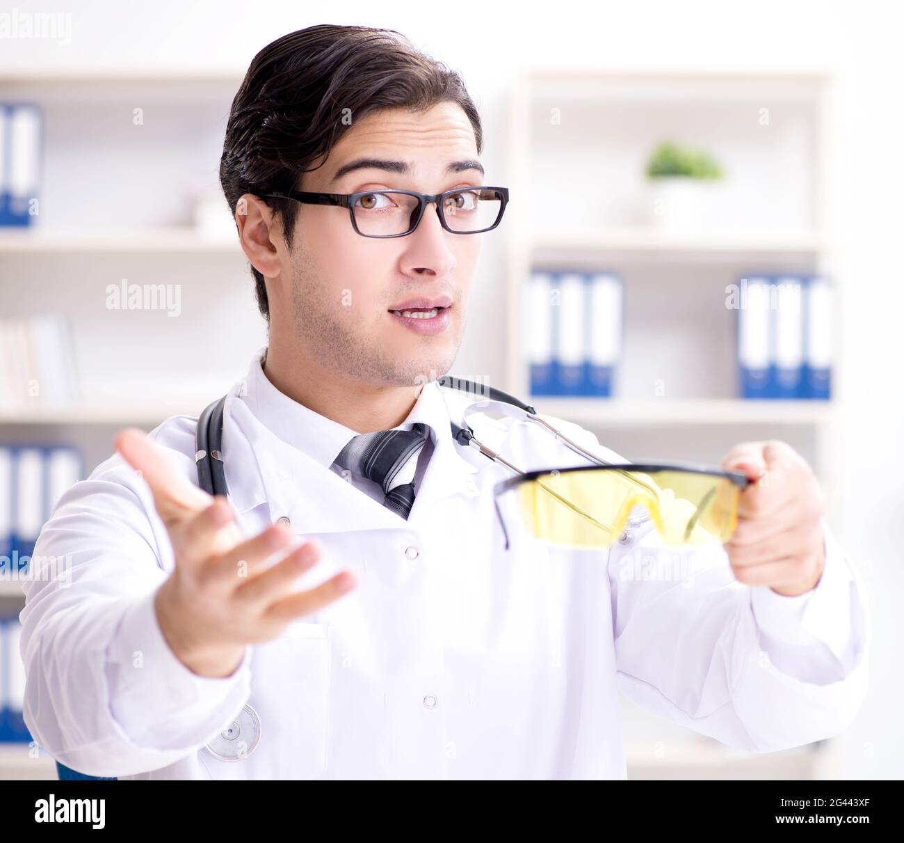 Safety doctor advising about wearing protective goggles Stock Photo - Alamy