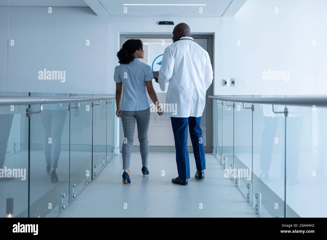 Black doctor rear view hi-res stock photography and images - Alamy