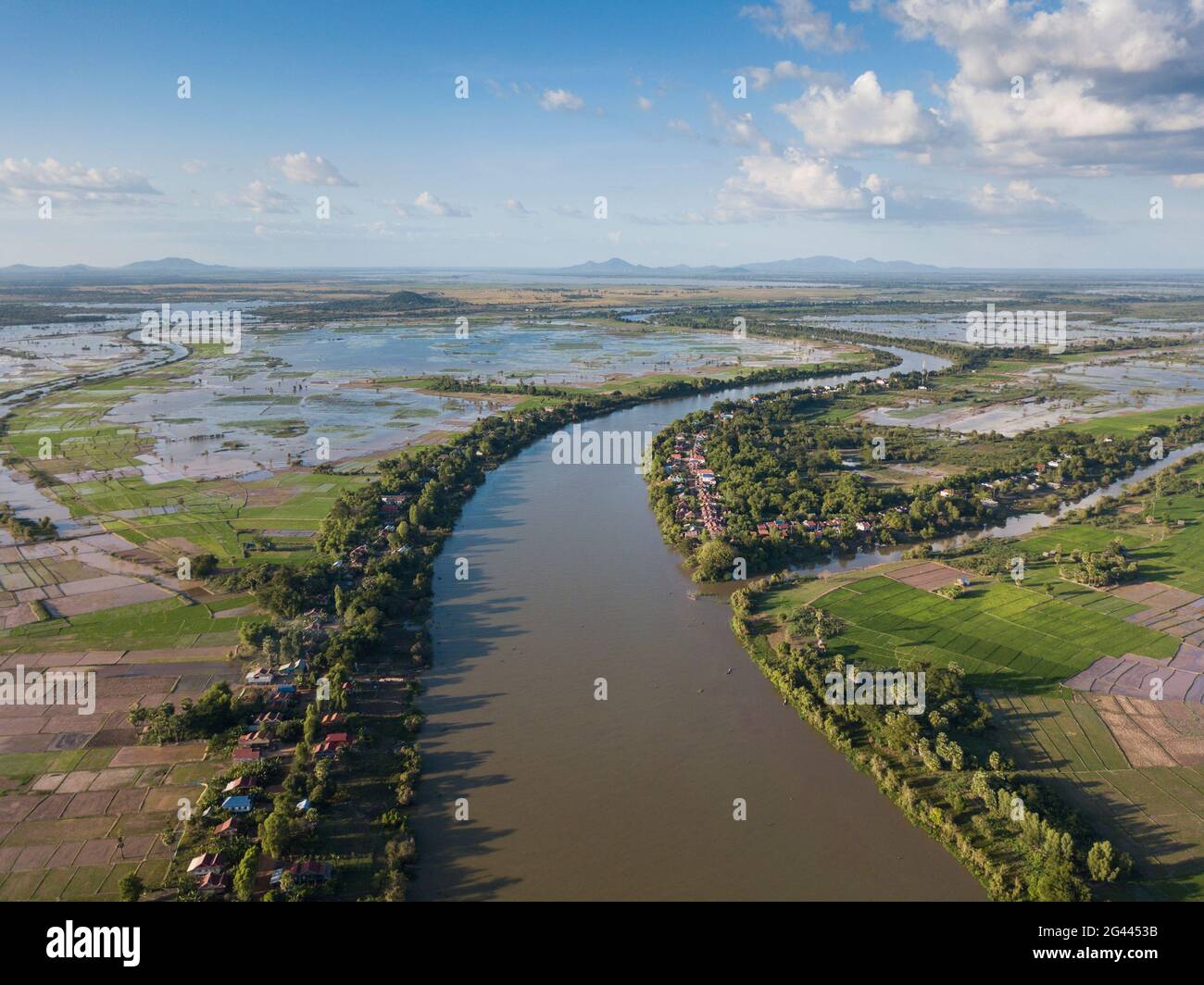Aerial view of Tonle Sap River, village and rice fields, Kampong Prasat ...