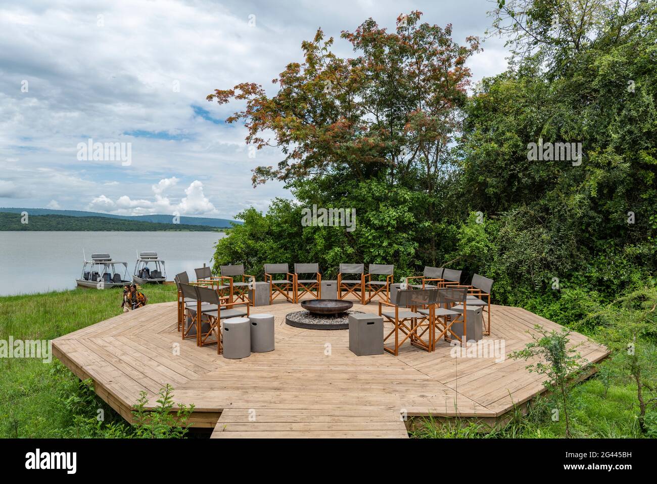 Chairs surround fire pit at the luxury tented resort Magashi Camp ...