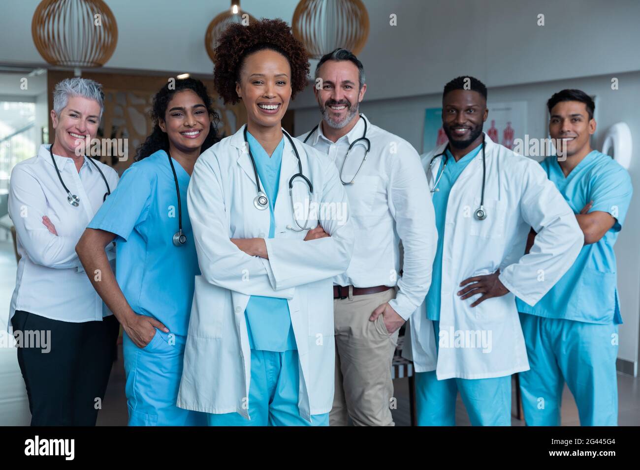 Portrait of group of diverse male and female doctors standing in ...