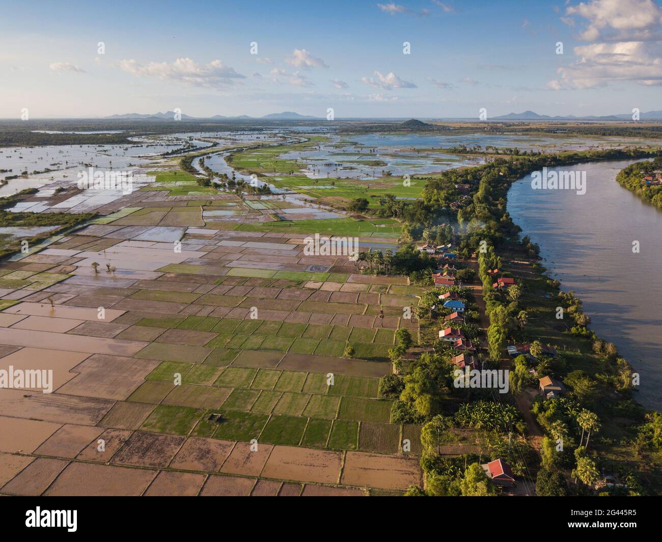 Aerial view of Tonle Sap River, village and rice fields, Kampong Prasat ...