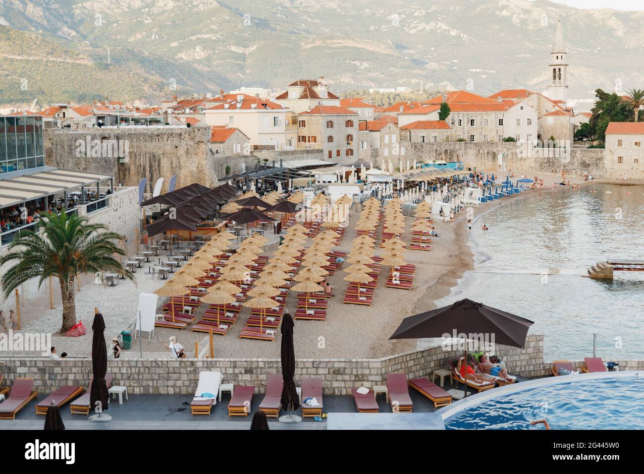View of the small beach of the old town of Budva, Montenegro against ...