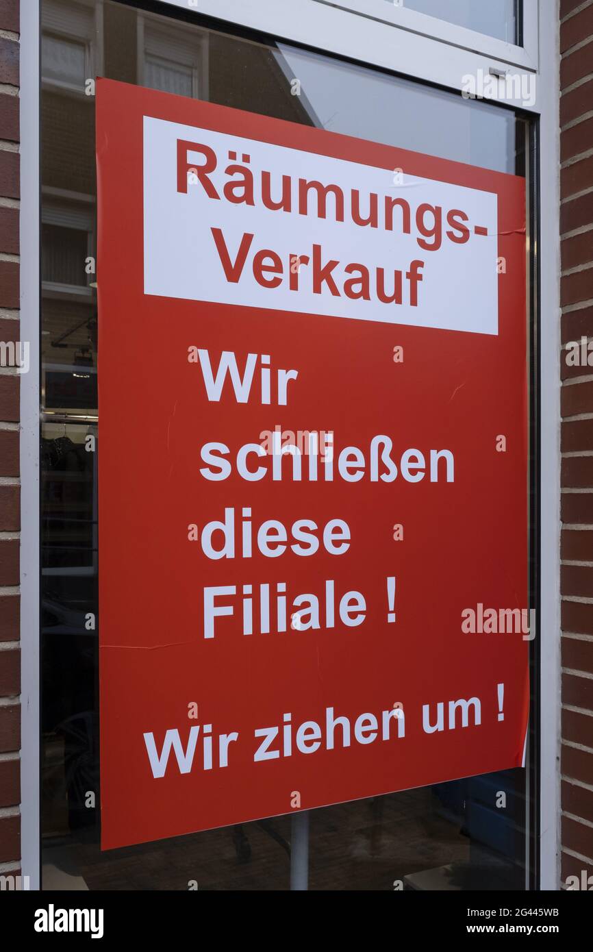 Shop window with sign clearance sale Stock Photo - Alamy