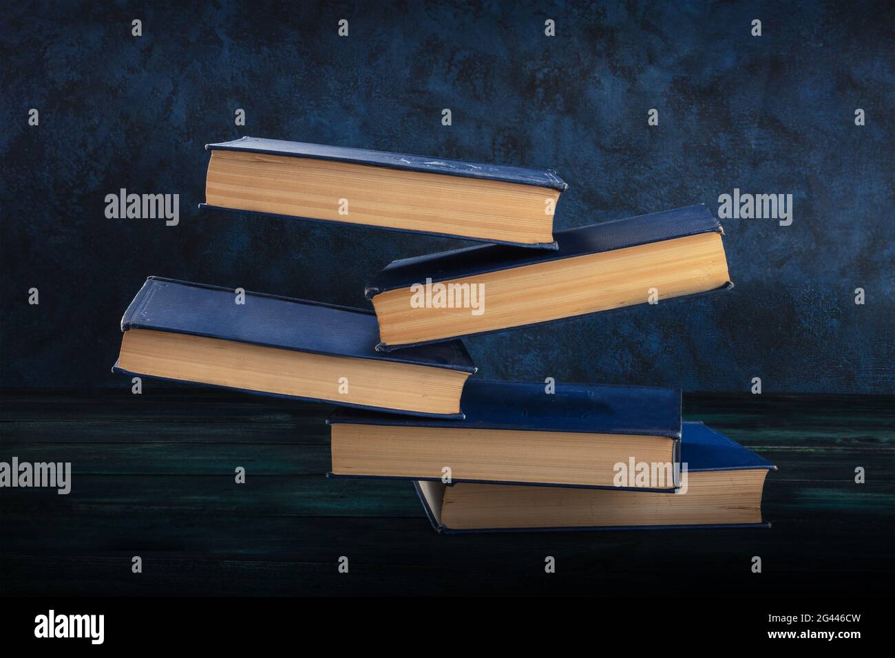 Falling books hi-res stock photography and images - Alamy
