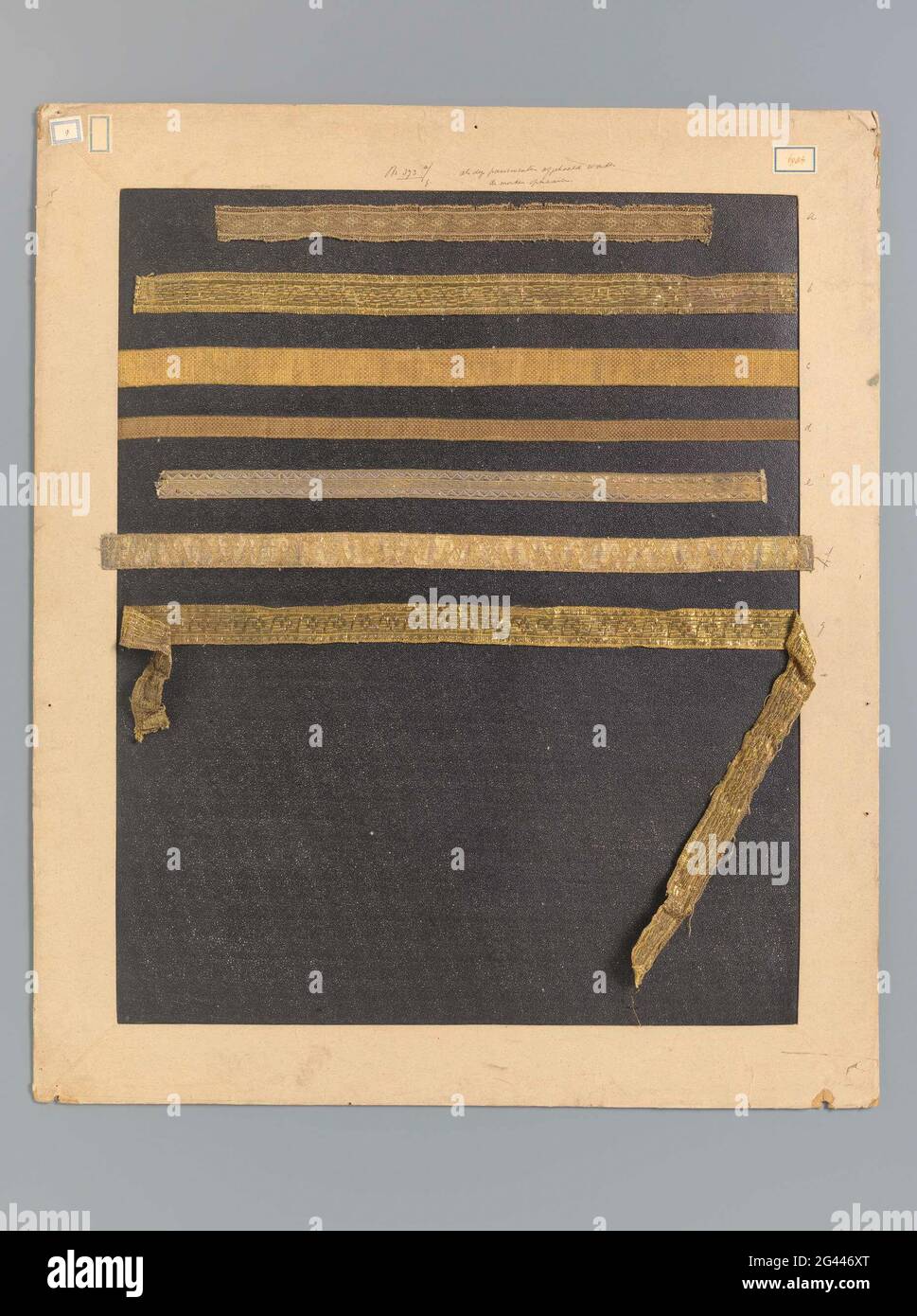 Seven golden passes on cardboard. Cardboard with seven gold colored ...