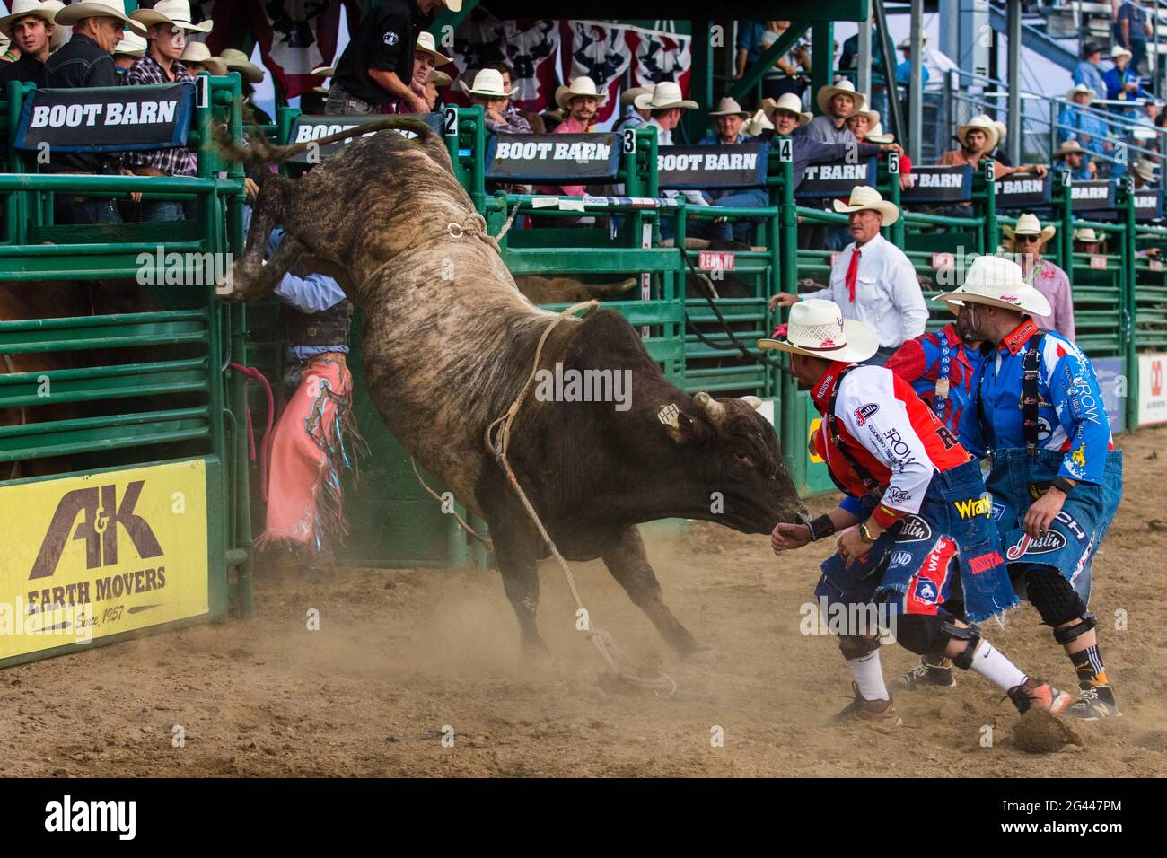 Jace Trosclair climbs to safety in the background while the ...
