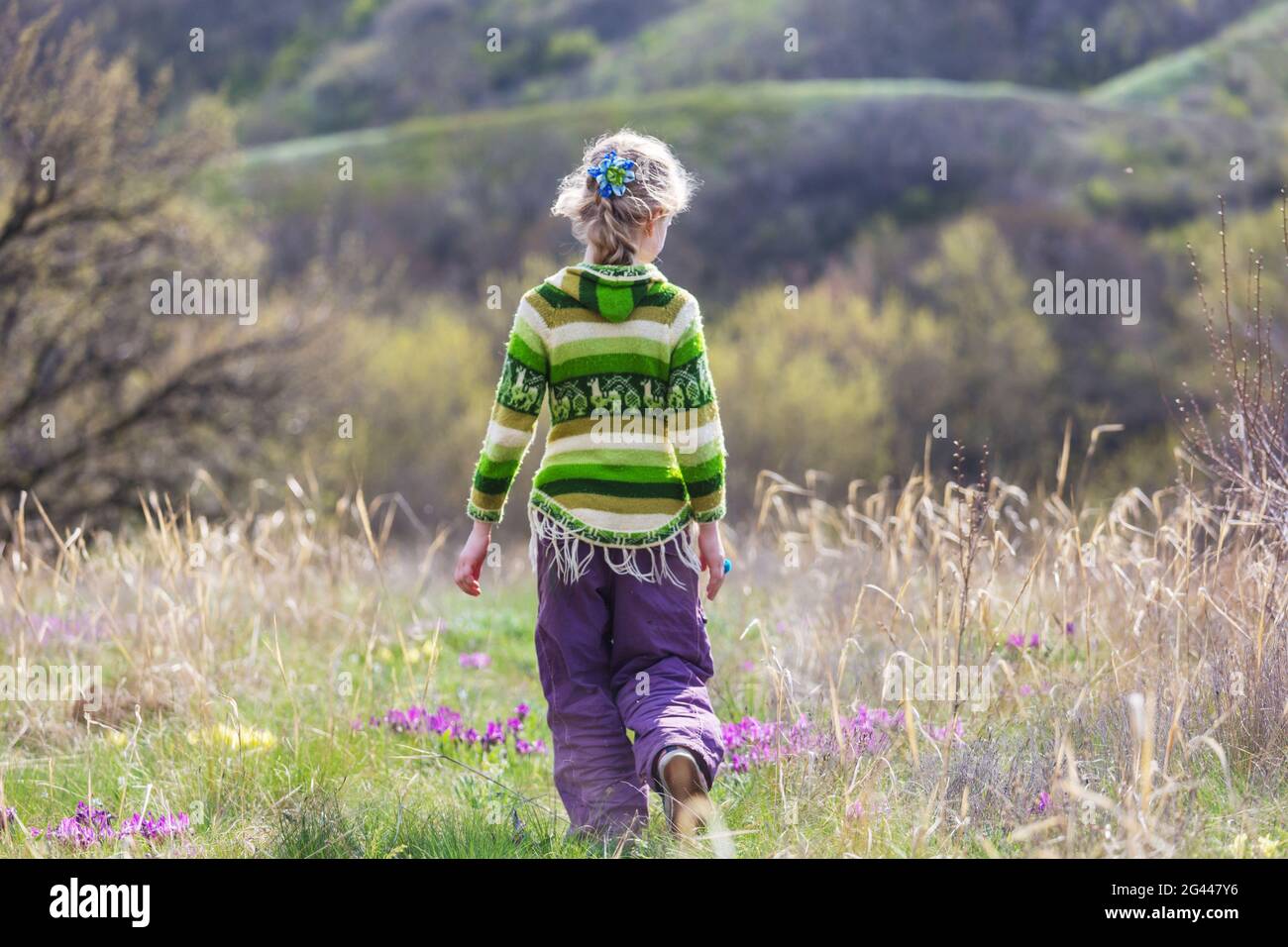 Girl on spring meadow Stock Photo - Alamy