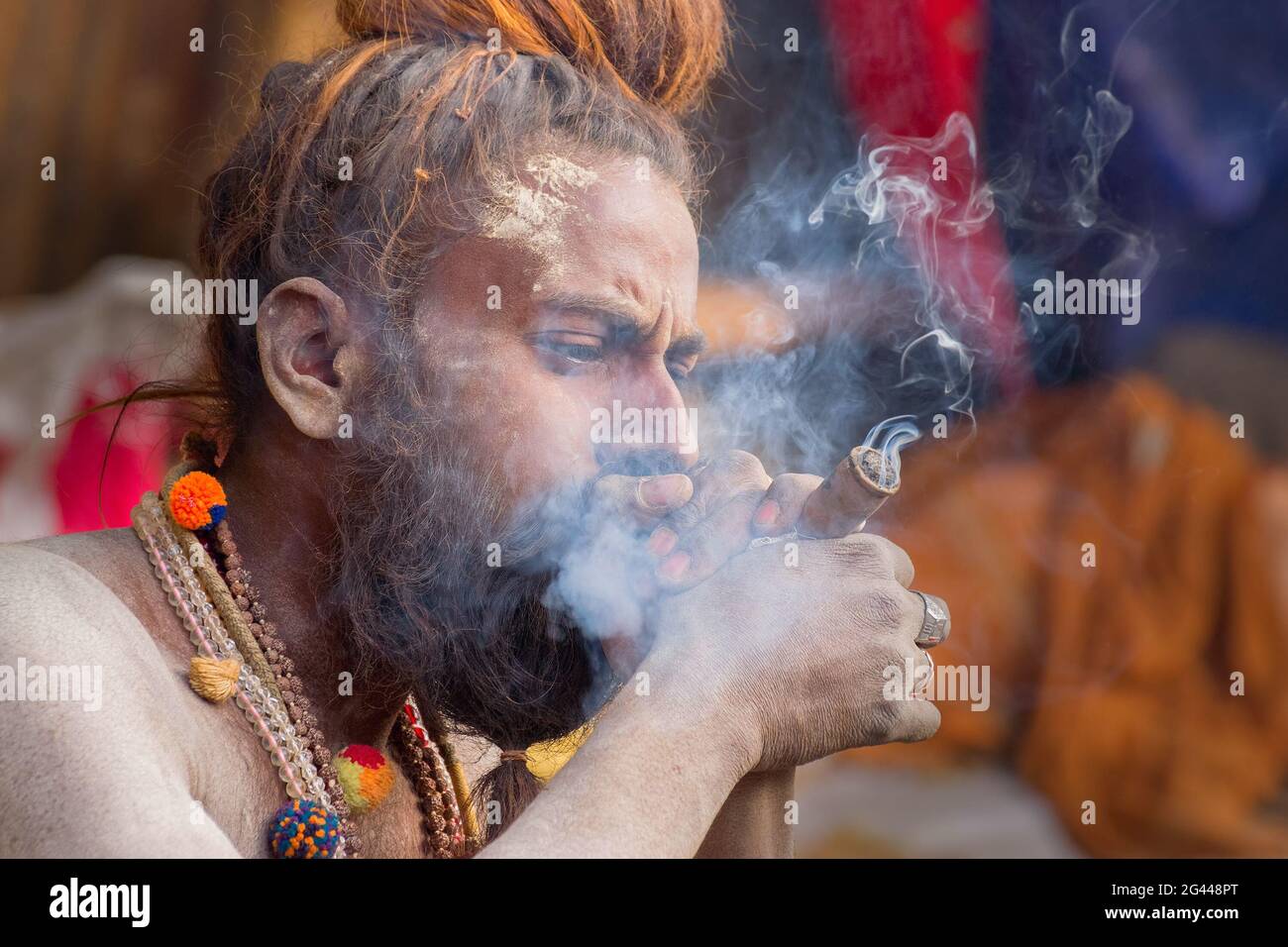 East indian man smoking hi-res stock photography and images - Alamy