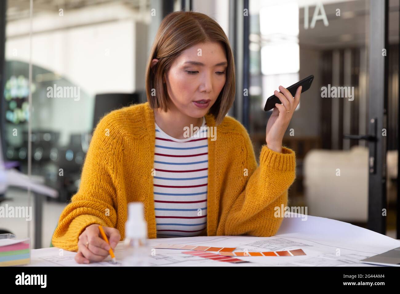 Portrait of asian businesswoman talking on smartphone having discussion ...