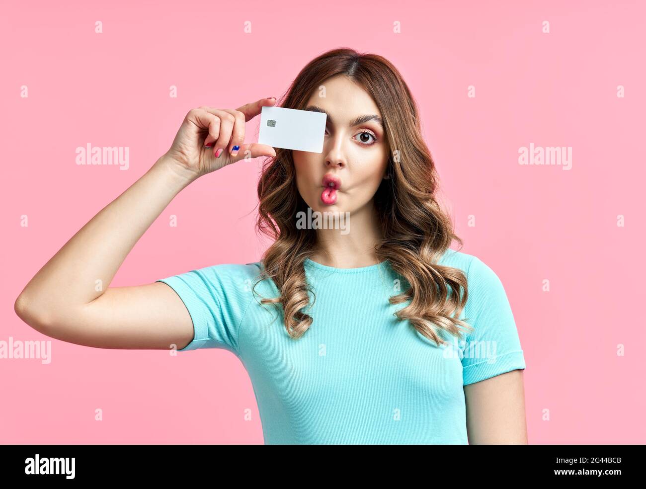 Portrait of a funny young woman having fun, making fish kisses face ...