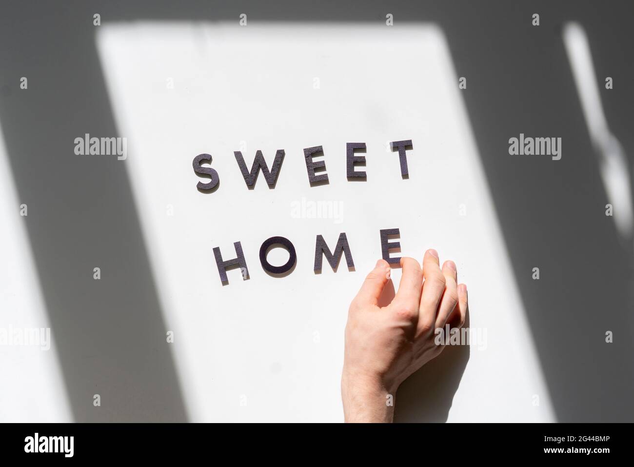 flat lay cut letters and home icon sign, view from above on table Stock ...
