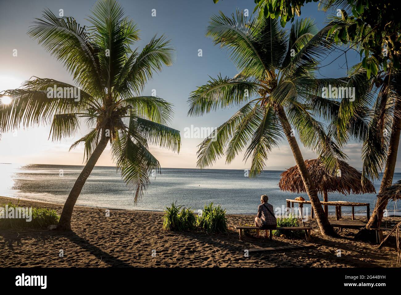 Tourist enjoys sunset on deserted beach, Malekula, Vanuatu, South ...