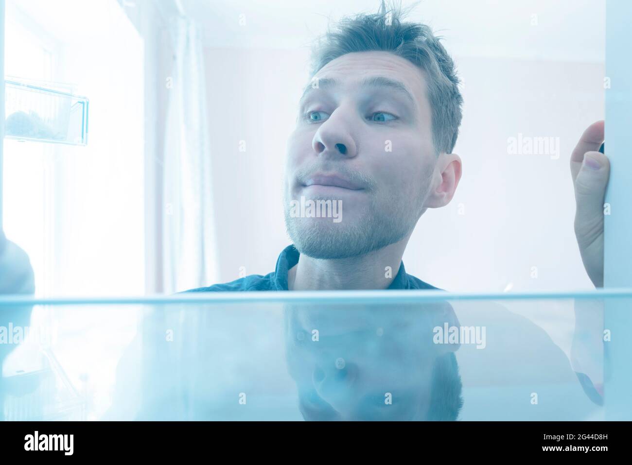 Man standing front fridge hi-res stock photography and images - Alamy