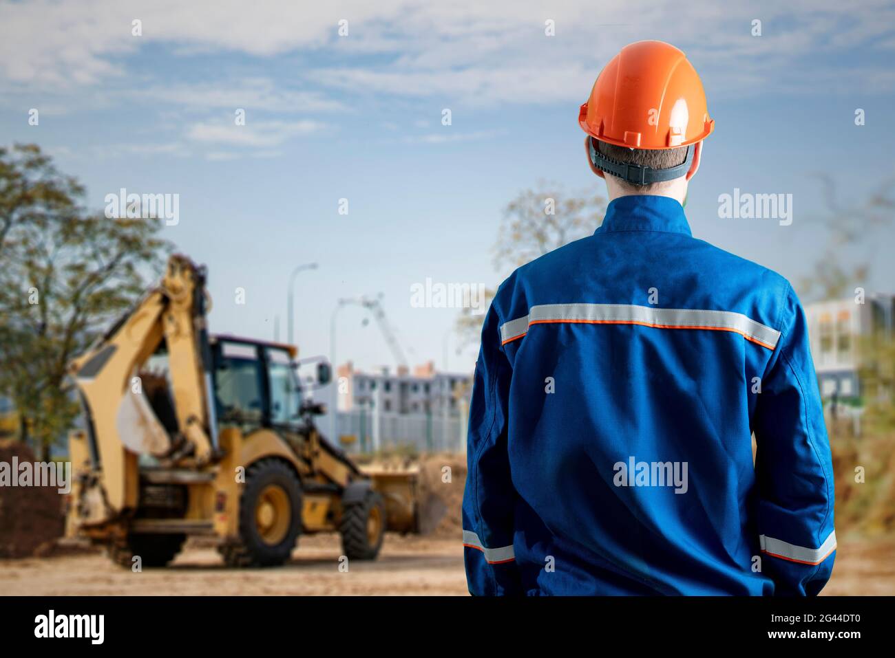 male worker in uniform doing work on the roadside building a new ...