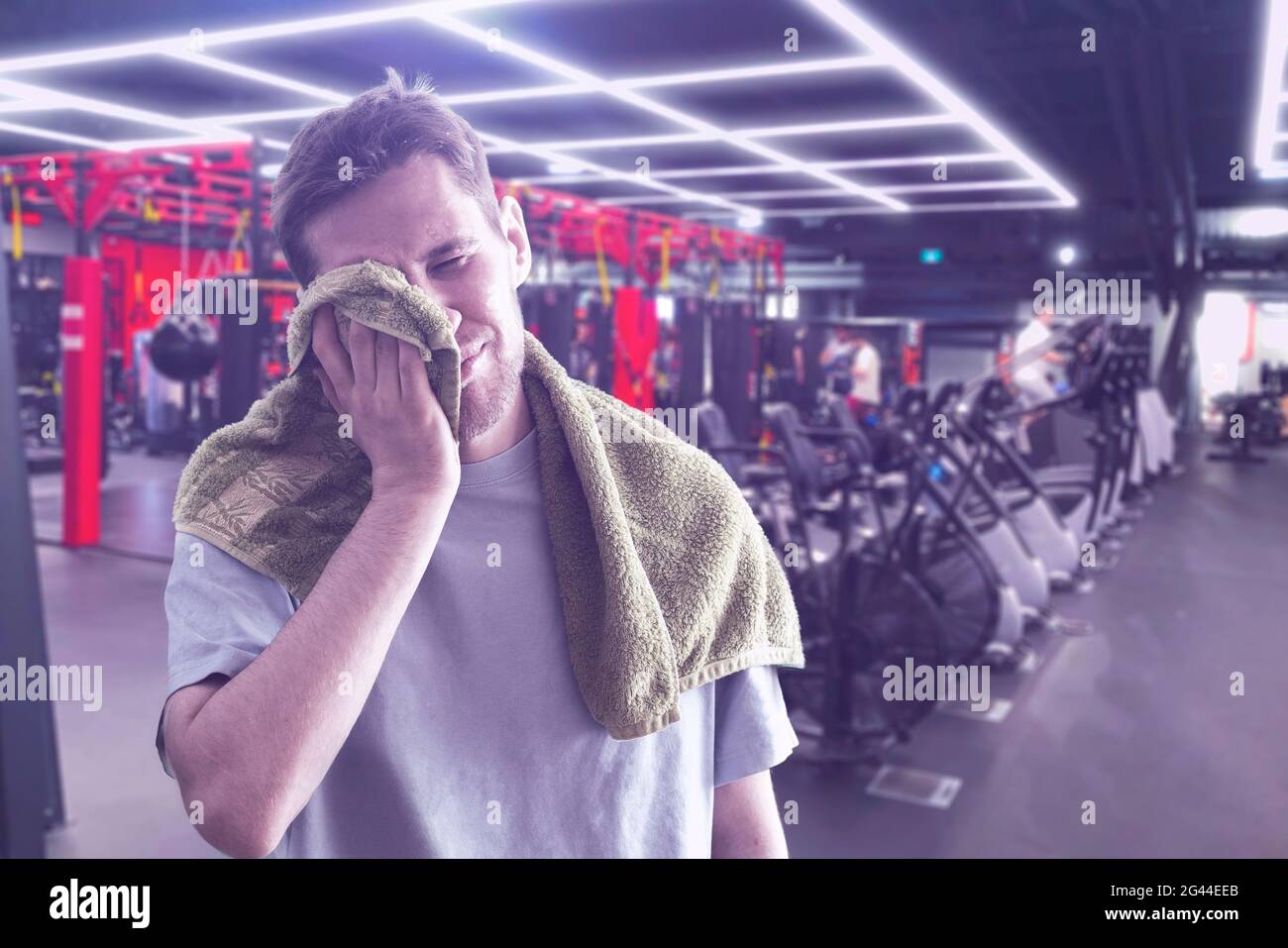 tired man in the gym after workout, using towel Stock Photo - Alamy