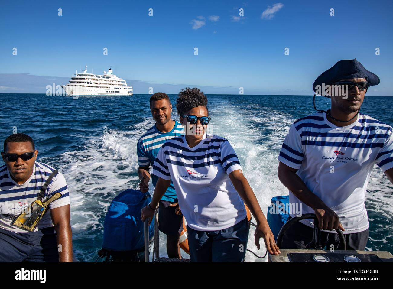 Four crew members of the cruise ship MV Reef Endeavor (Captain Cook ...