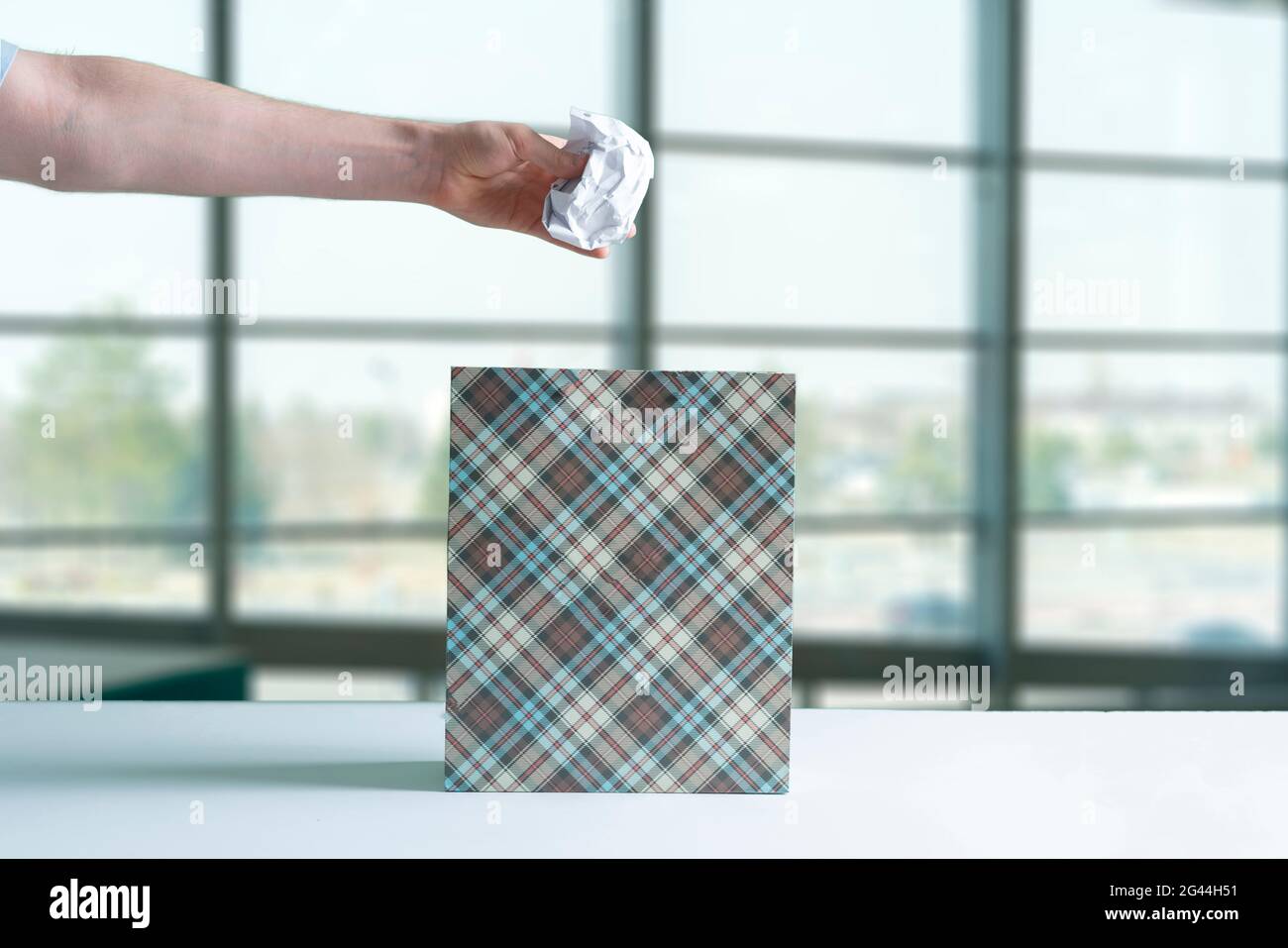 hand throw the crumpled paper piece in the trash basket Stock Photo - Alamy