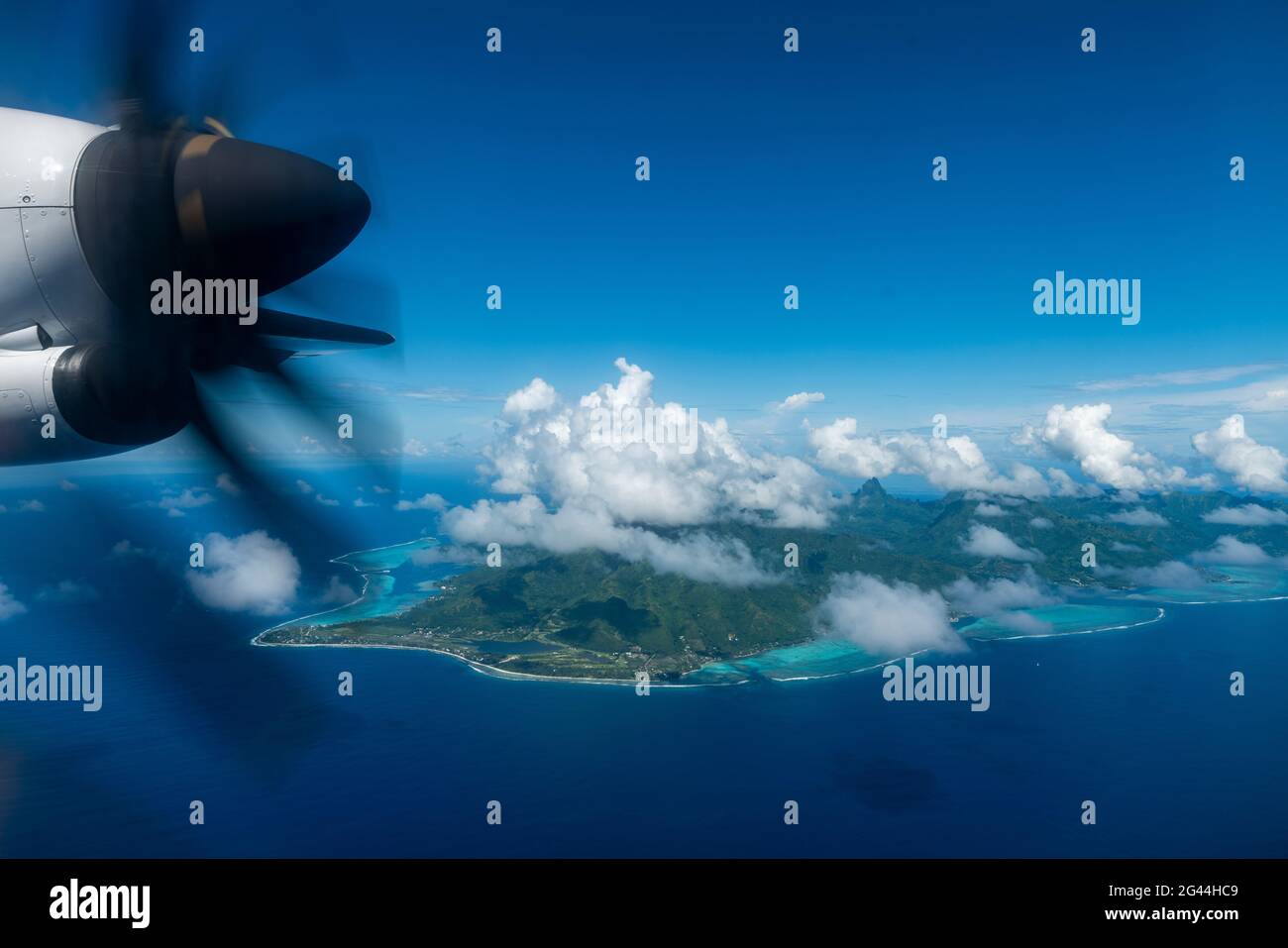 Aerial view with engine of Air Tahiti ATR 72-600 airplane and Moorea ...