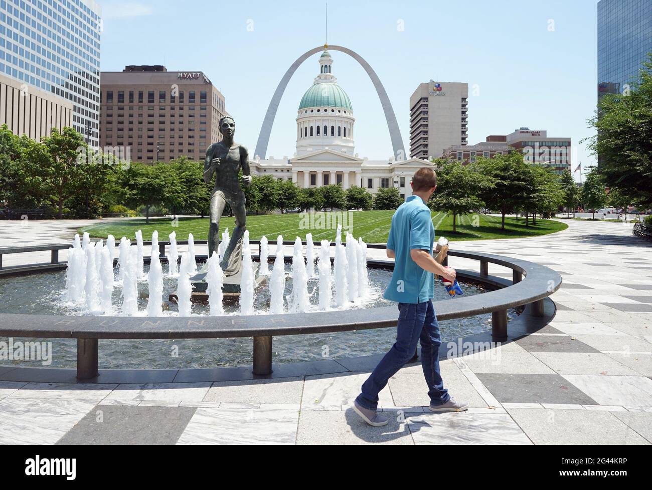 St. Louis, USA. 19th June, 2021. A visitor to Kiener Plaza walks past ...