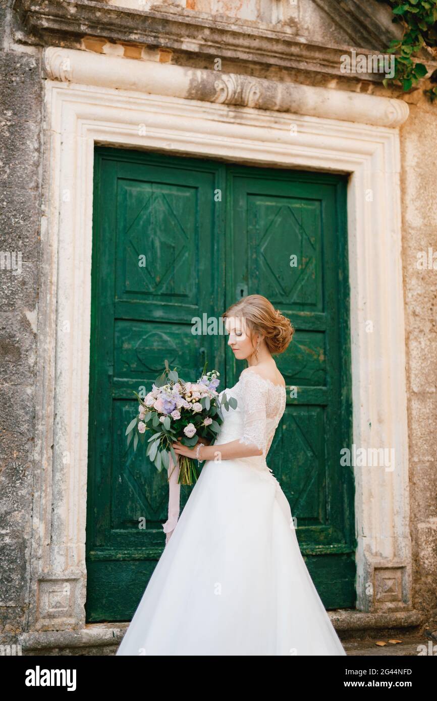 Tender bride stands bouquet hi-res stock photography and images - Alamy