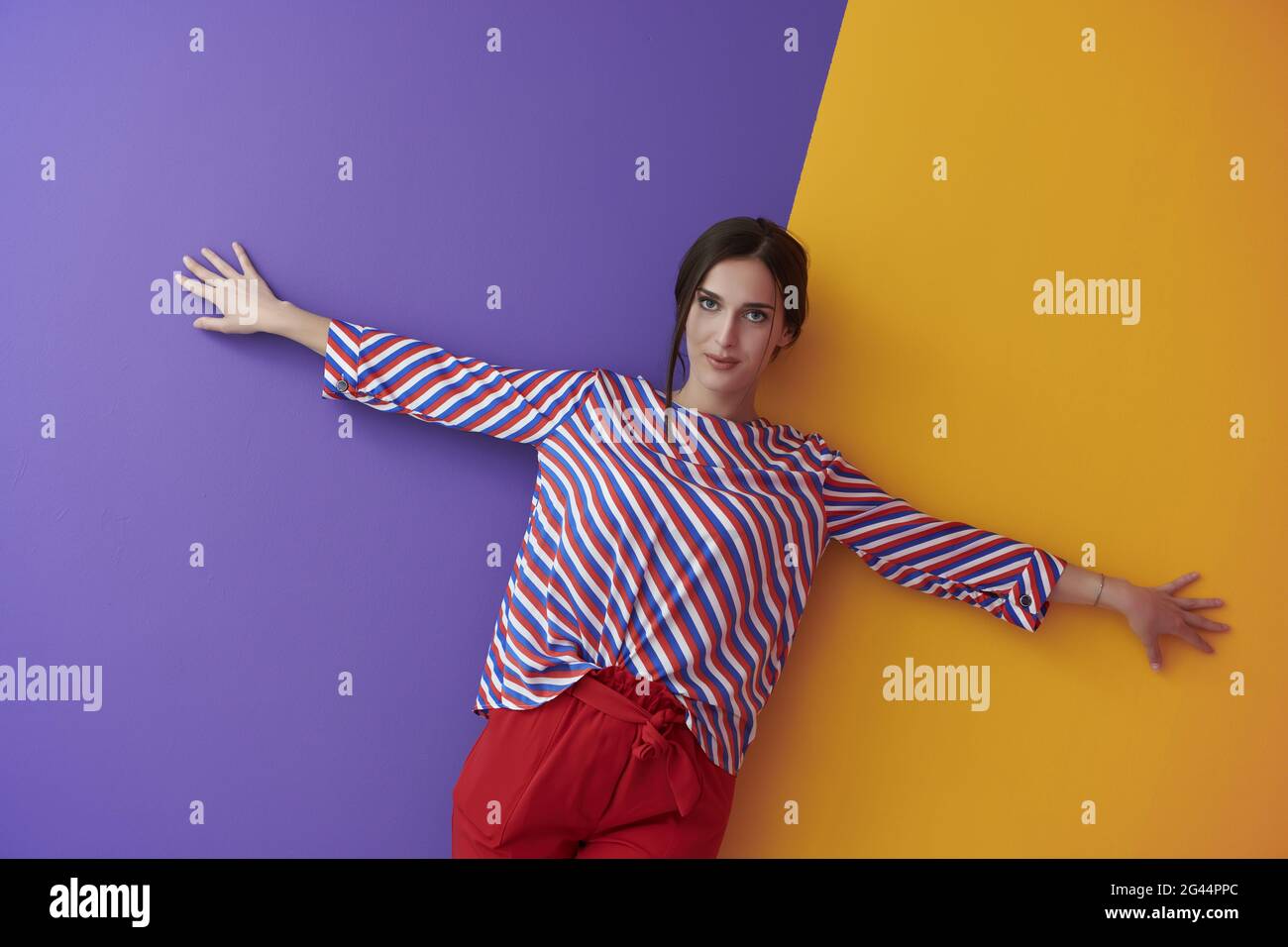 Young female model with open wide arms Stock Photo - Alamy