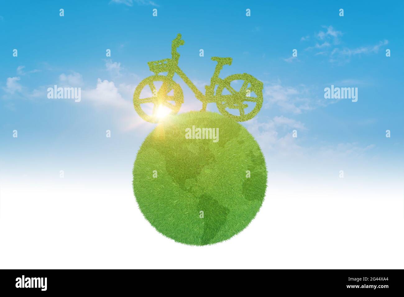 Green bicycle driving with planet over blue sky background. Environment ...