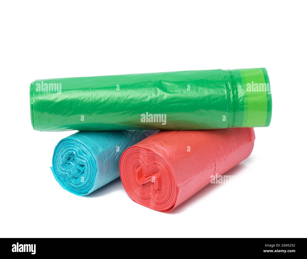 Stack of polyethylene multicolored disposable trash bags on white ...