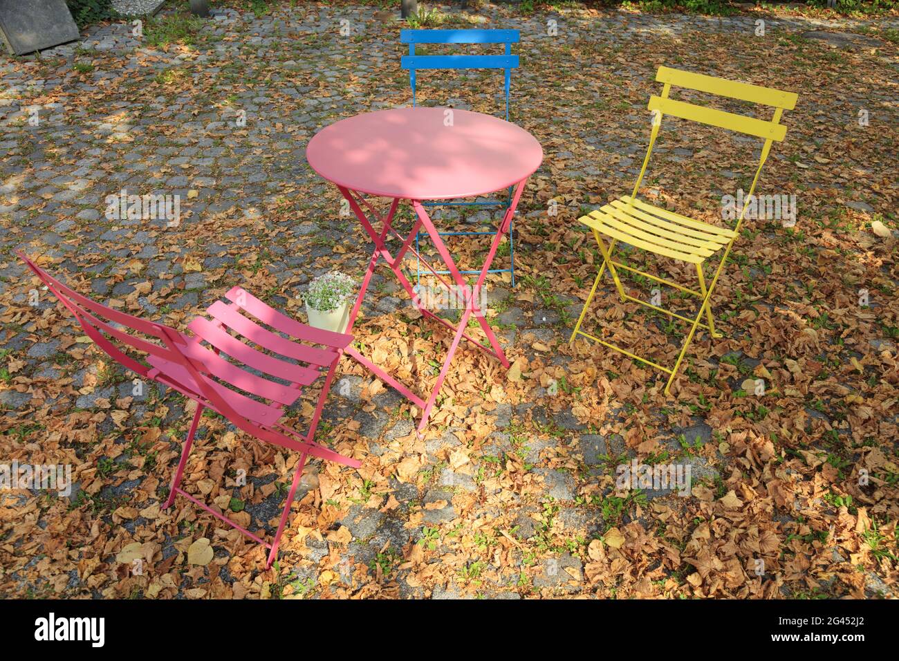 Colored table and chairs Stock Photo - Alamy