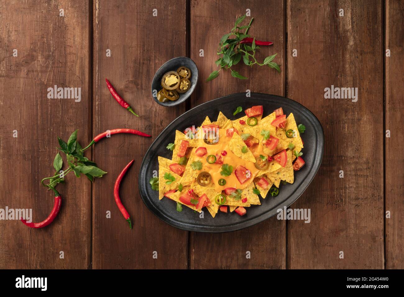 Mexican nachos, shot from the top with a cheese sauce, chili and ...