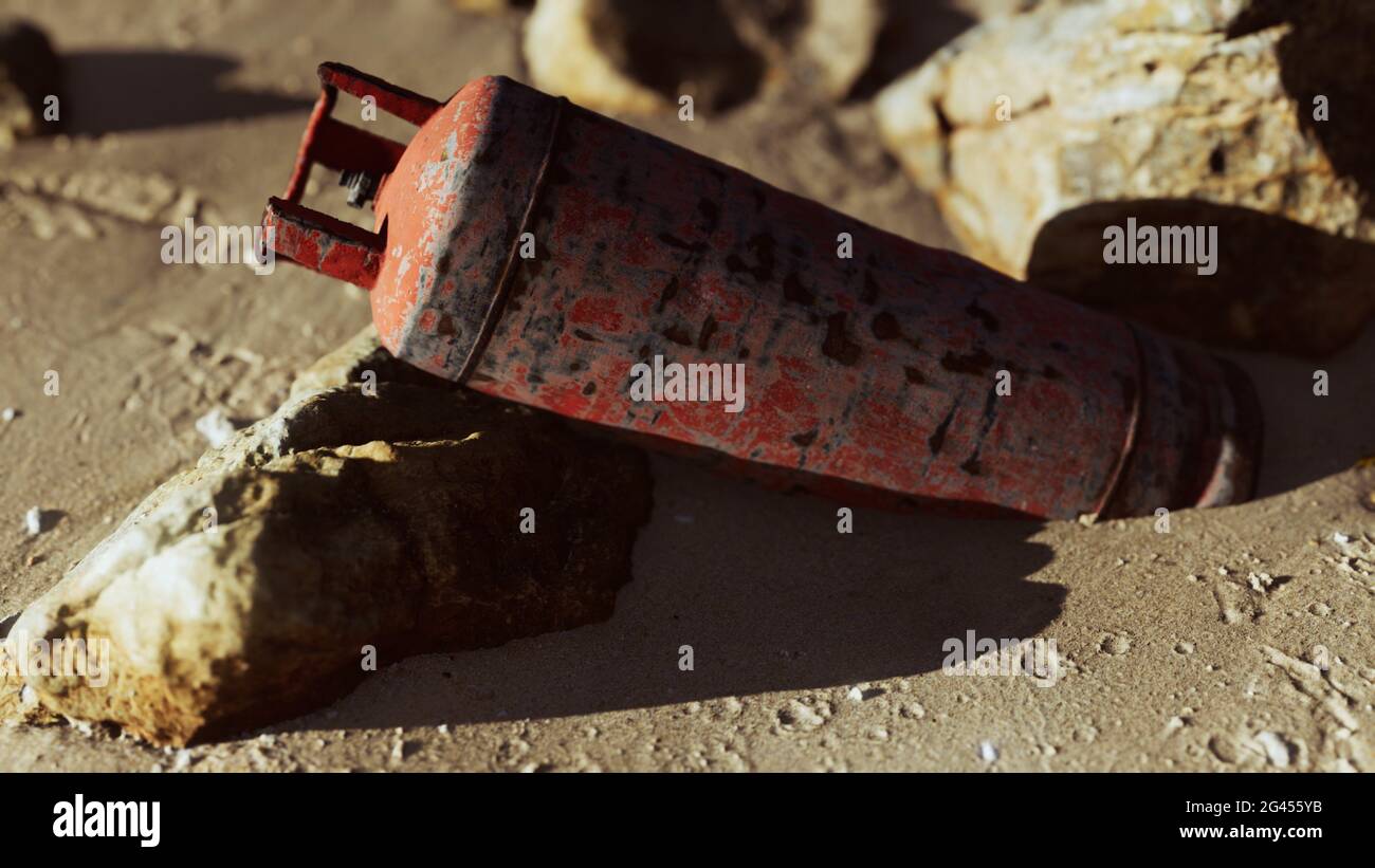 Old rusted gas tank on sand beach Stock Photo - Alamy