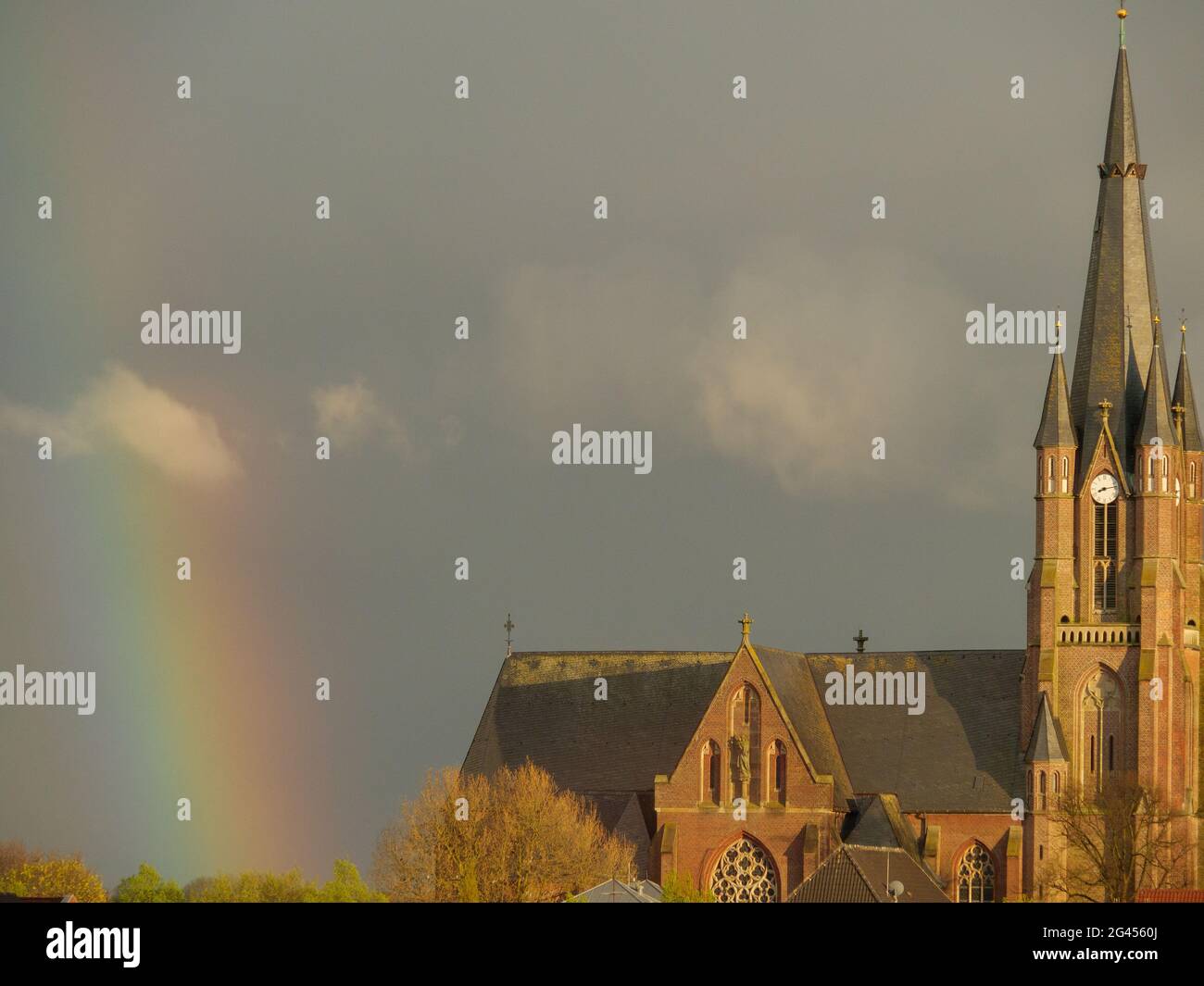 Rainbow and church Stock Photo - Alamy