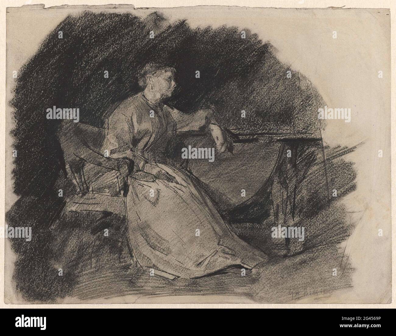 Seated lady at a table Stock Photo - Alamy