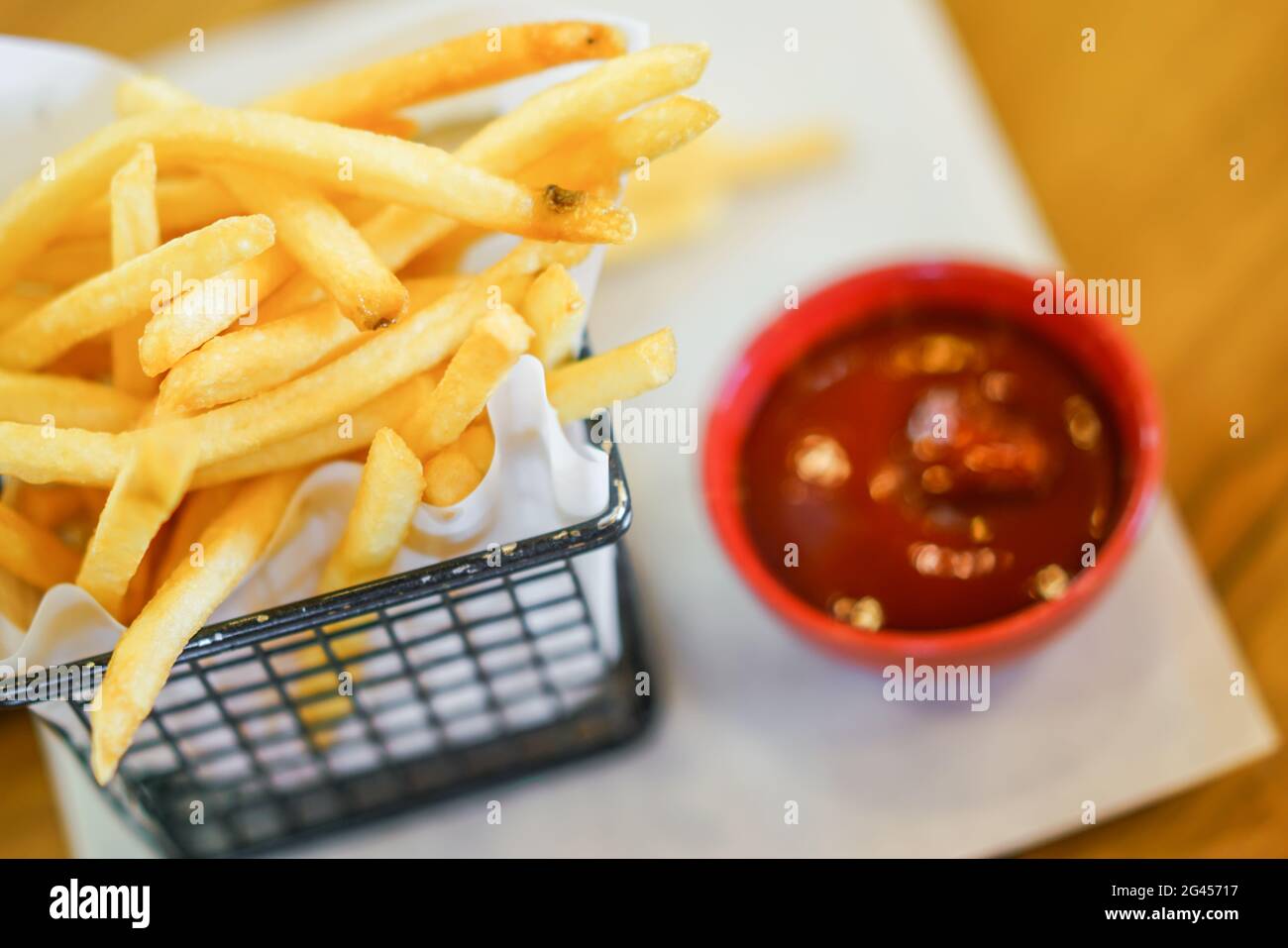 French fries on wood table Stock Photo - Alamy