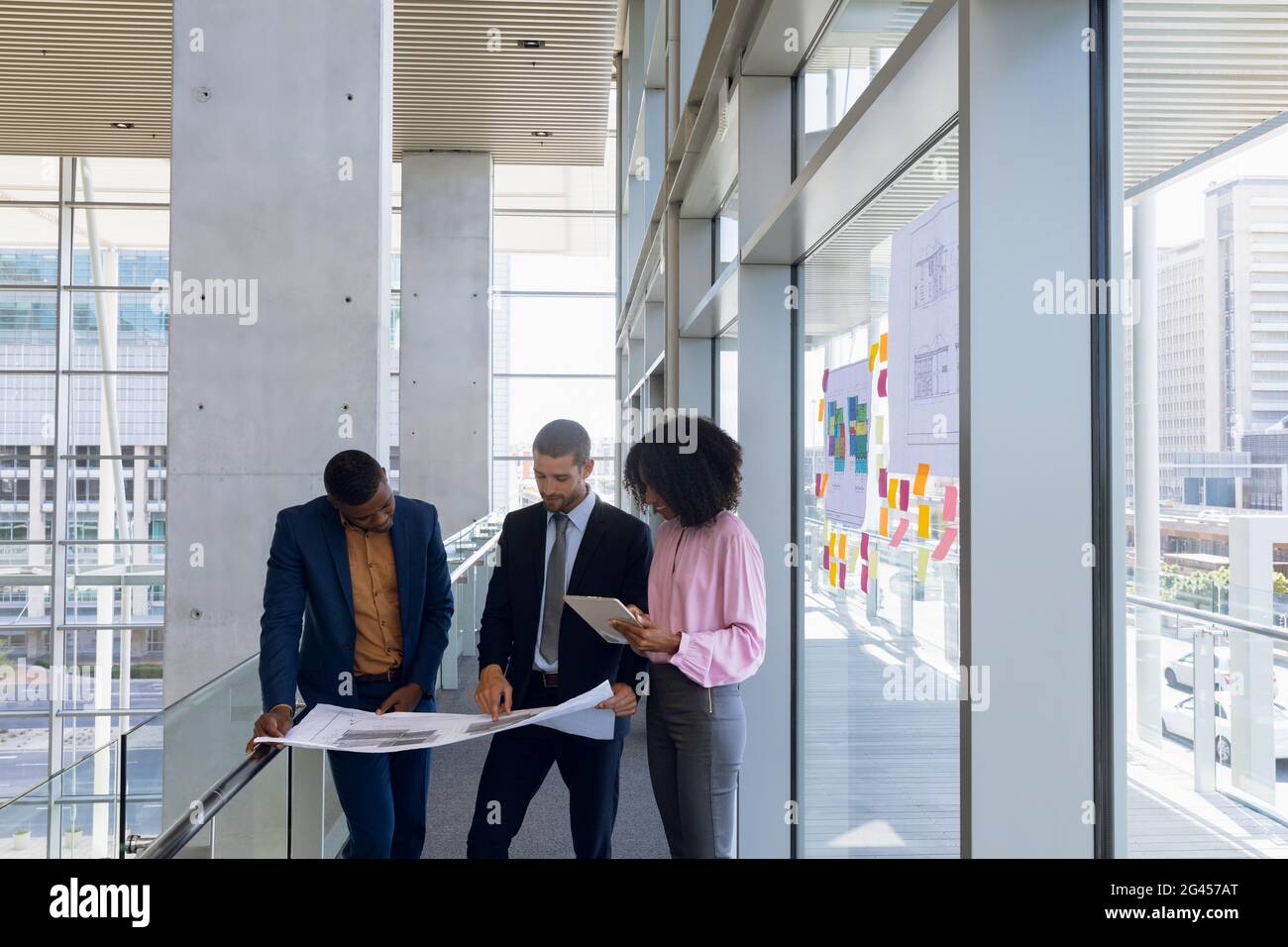 Team diverse colleagues discussing standing hi-res stock photography ...