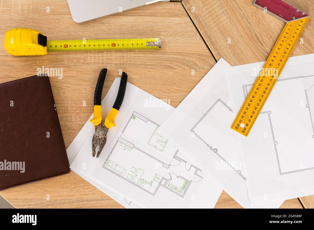 Architect working on blueprint. Architects workplace - architectural ...