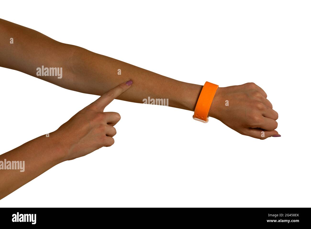 Woman pointing to her arm Stock Photo - Alamy