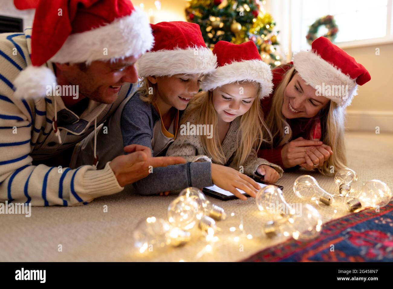 Family at home at Christmas time Stock Photo - Alamy