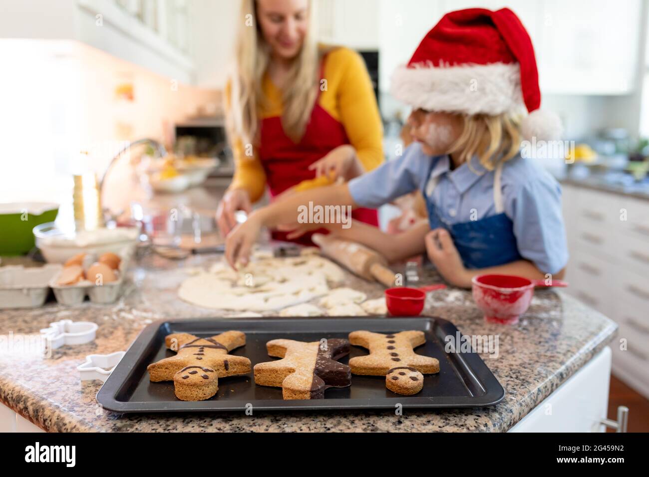 Family making Christmas cookies at home Stock Photo - Alamy
