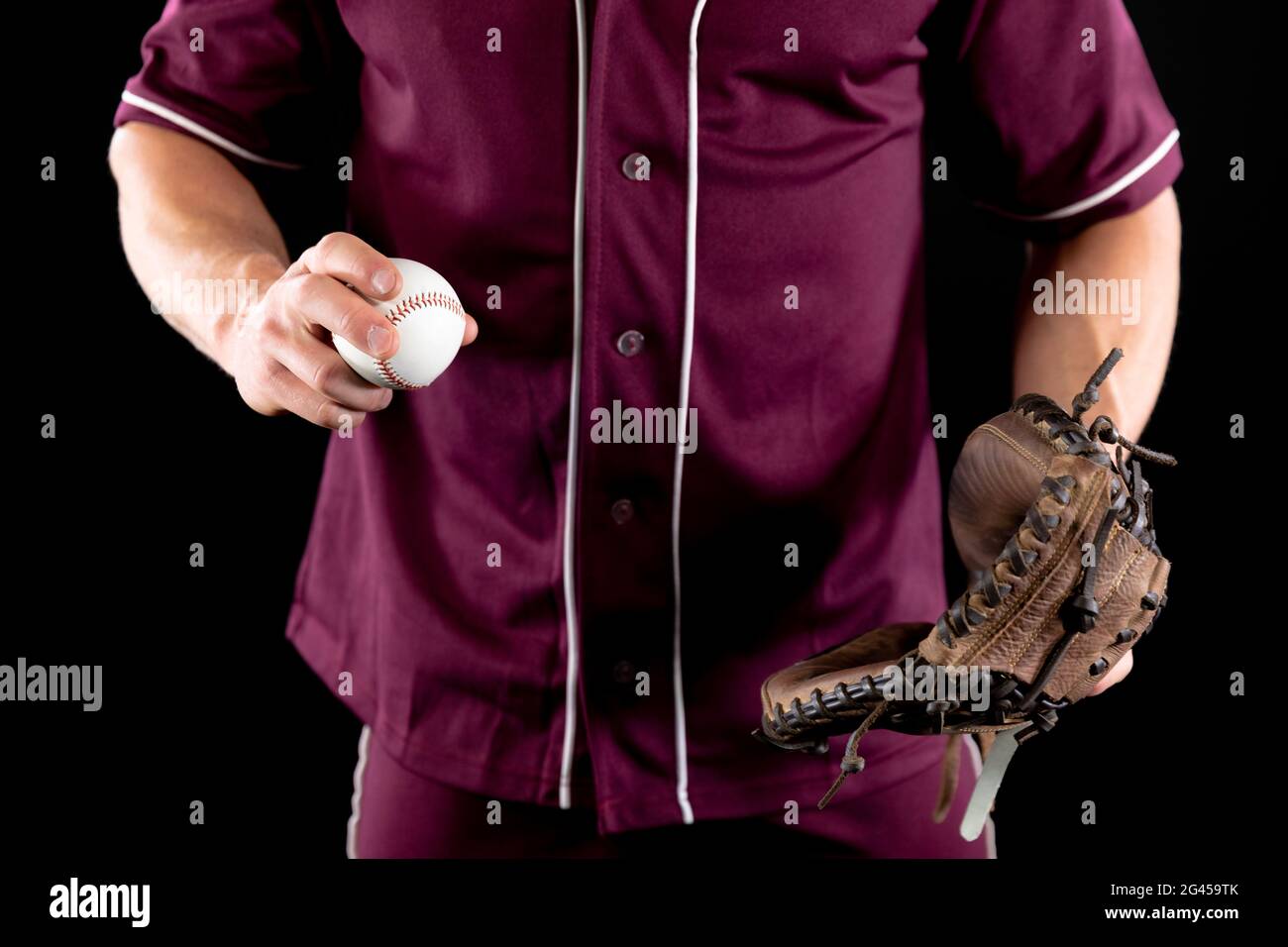 Baseball player holding out baseball hi-res stock photography and ...